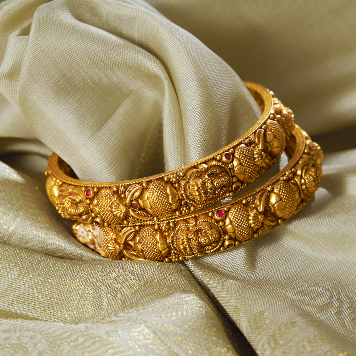 Temple Style Gold Bangles Carved With Lakshmi Motif - Rajwadi Jewellers